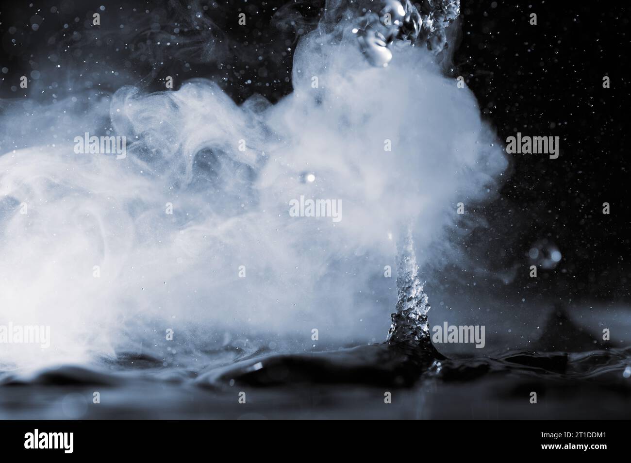 Boiling water splash with steam on black background close-up Stock ...