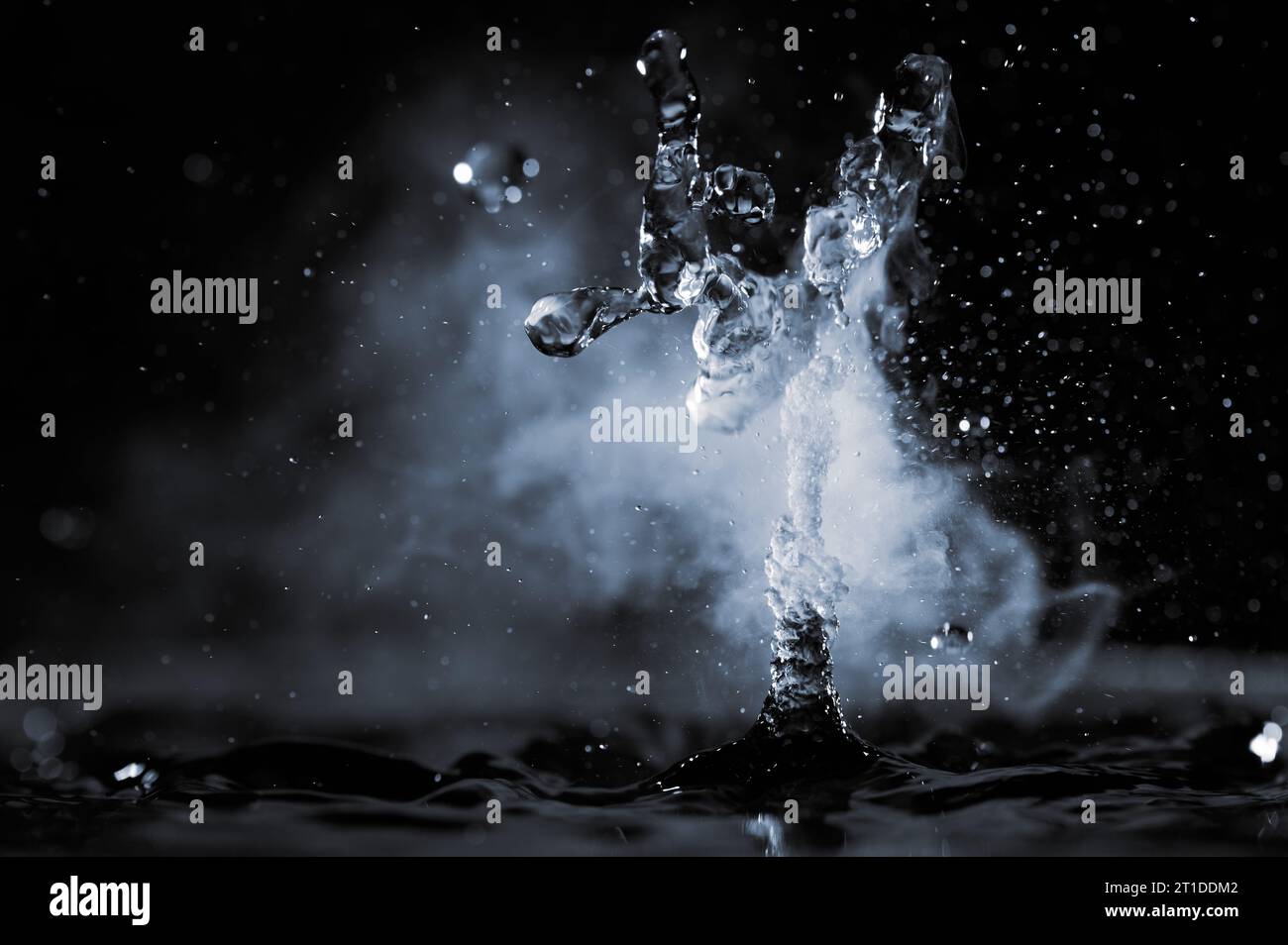 Boiling water splash with steam on black background close-up Stock ...