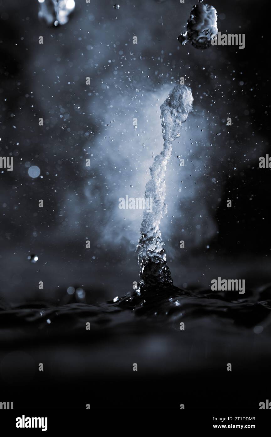 Boiling water splash with steam on black background close-up Stock ...