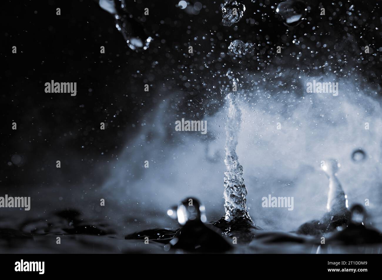 Boiling water splash with steam on black background close-up Stock ...
