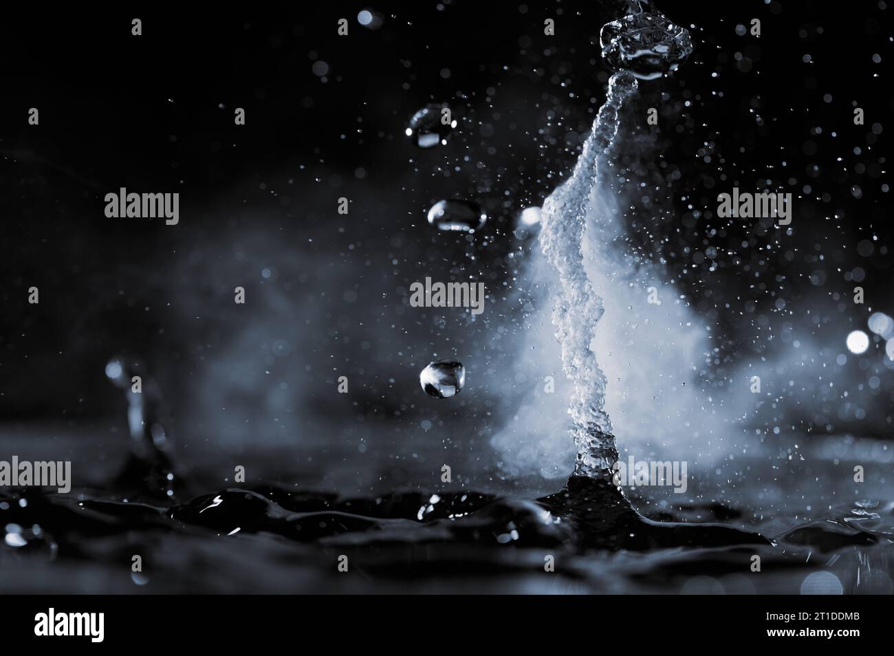 Boiling water splash with steam on black background close-up Stock ...