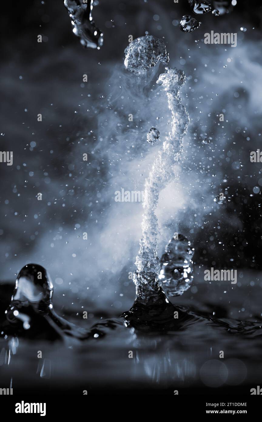 Boiling water splash with steam on black background close-up Stock ...