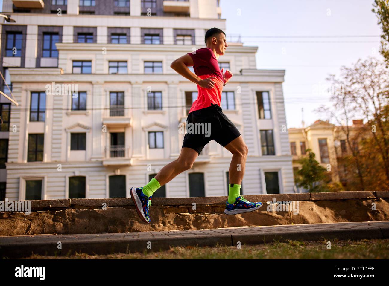 Dynamic image of man, professional runner in motion, training, running ...