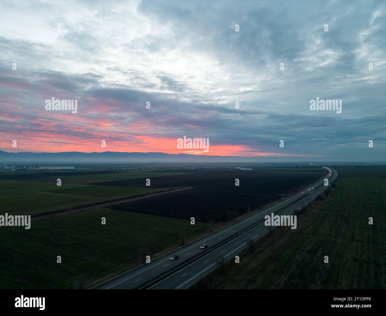 Aerial top view of highway road at sunset in autumn. Top view from ...