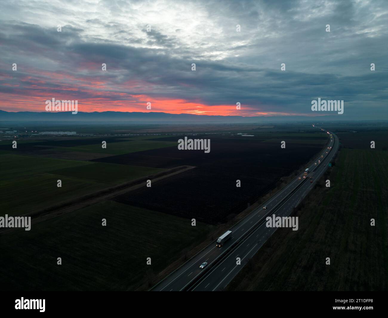 Aerial top view of highway road at sunset in autumn. Top view from ...