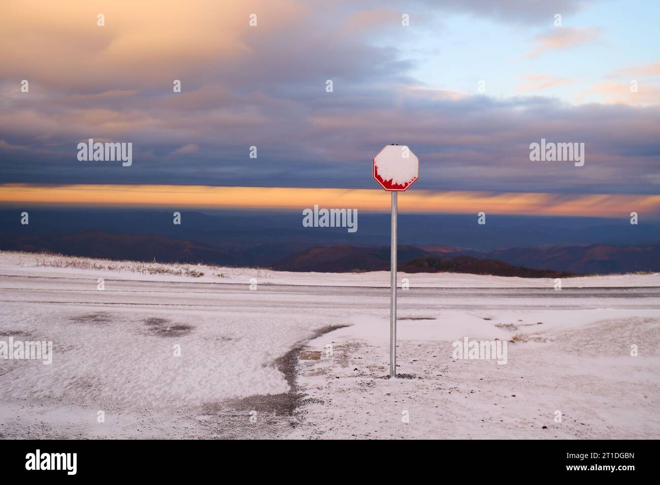 Snow covered Stop sign in Balkan Mountains in Beklemeto pass region at ...