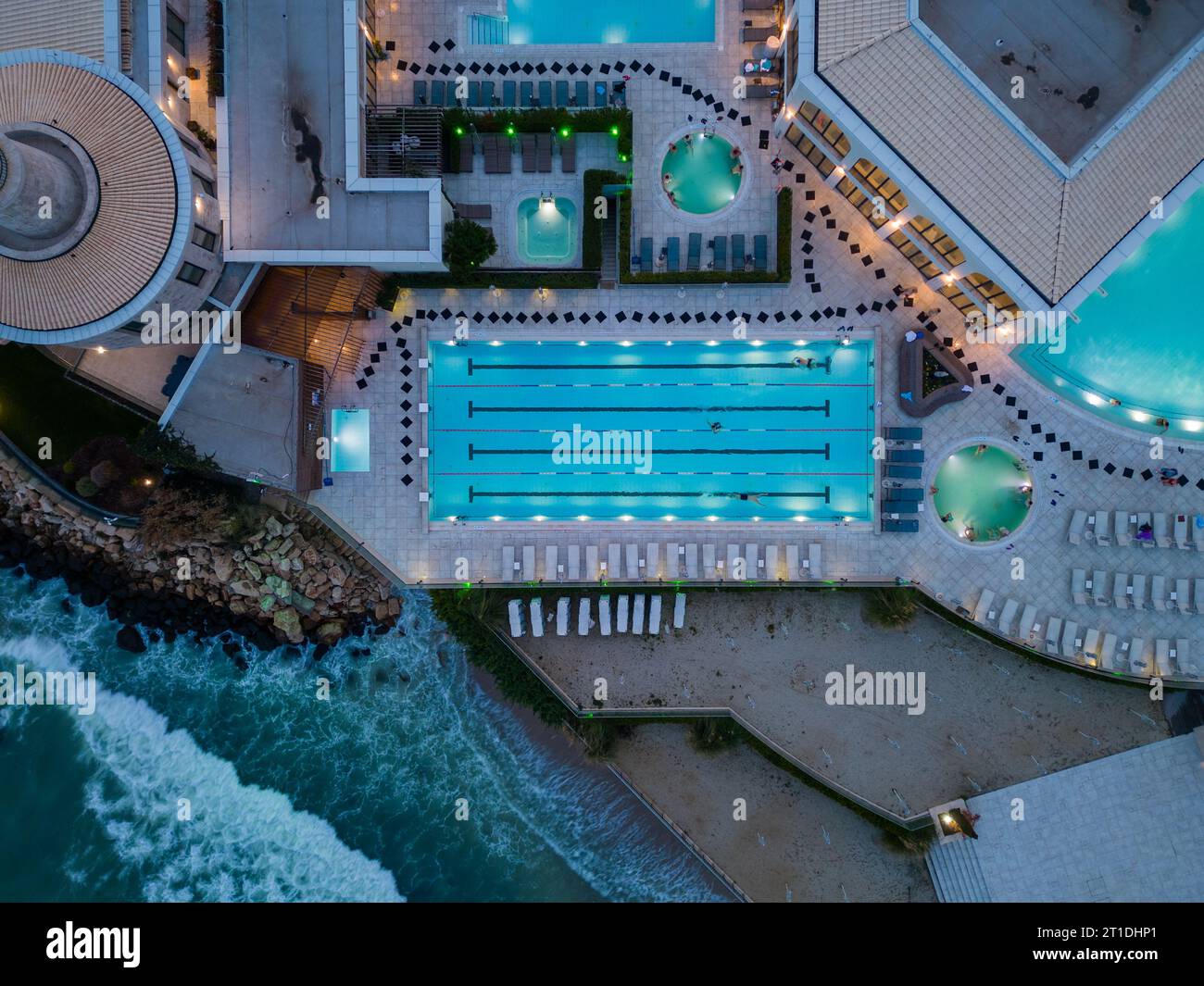 Aerial top view of several pools in the spa center on a sea coast at ...