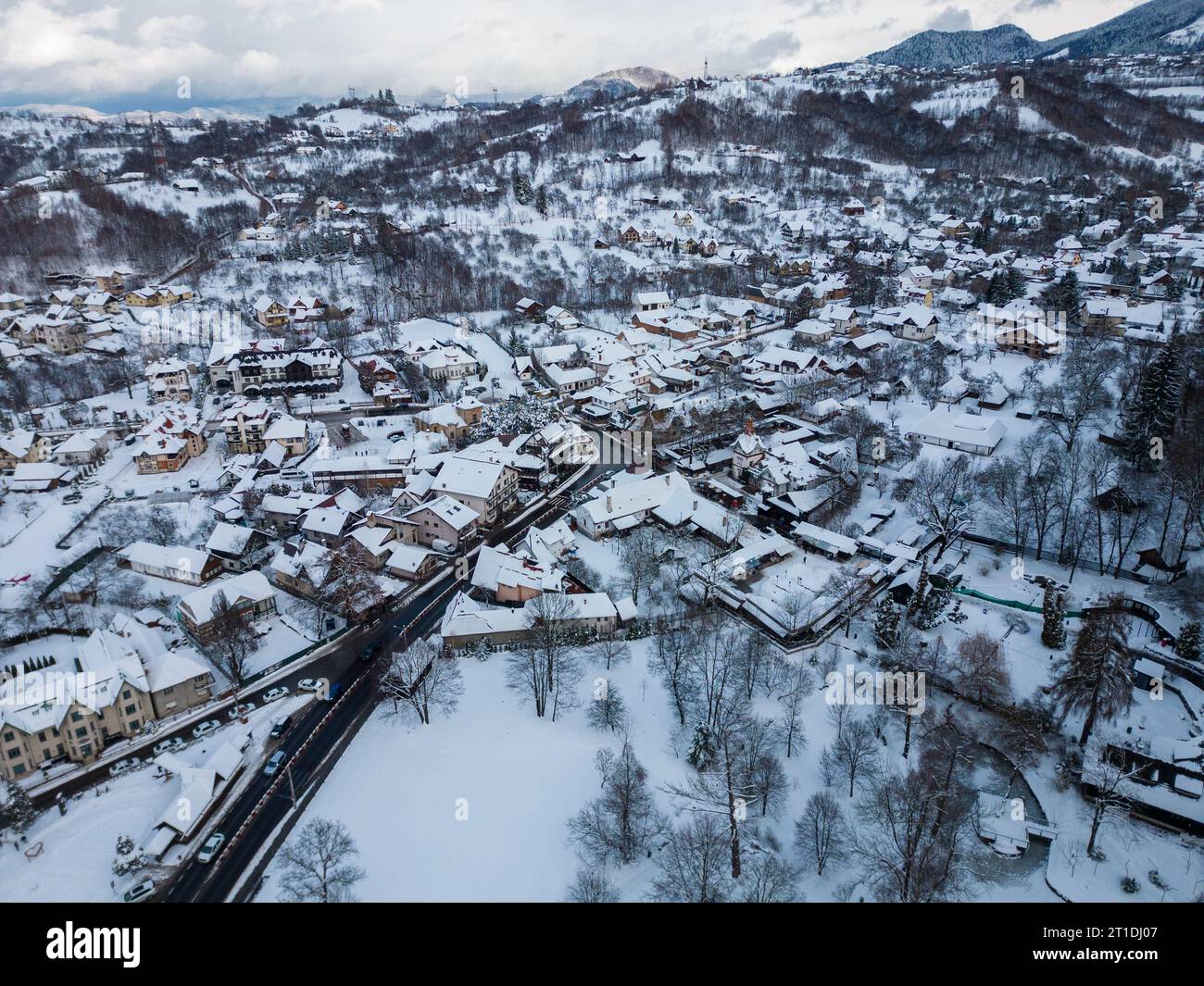 Aerial top view of Bran city covered with snow in winter, Romania Stock ...