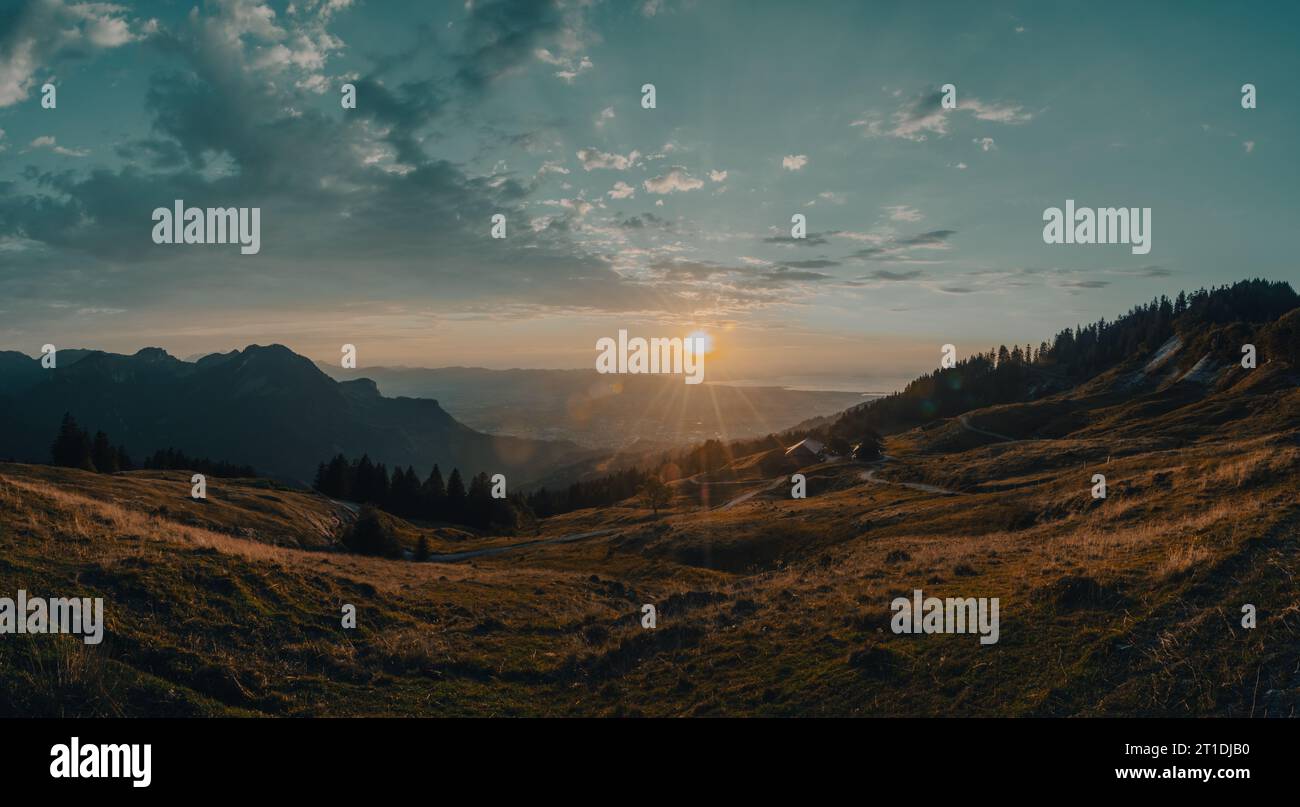 Warm sunset on a late summer evening in the Austrian mountains with ...