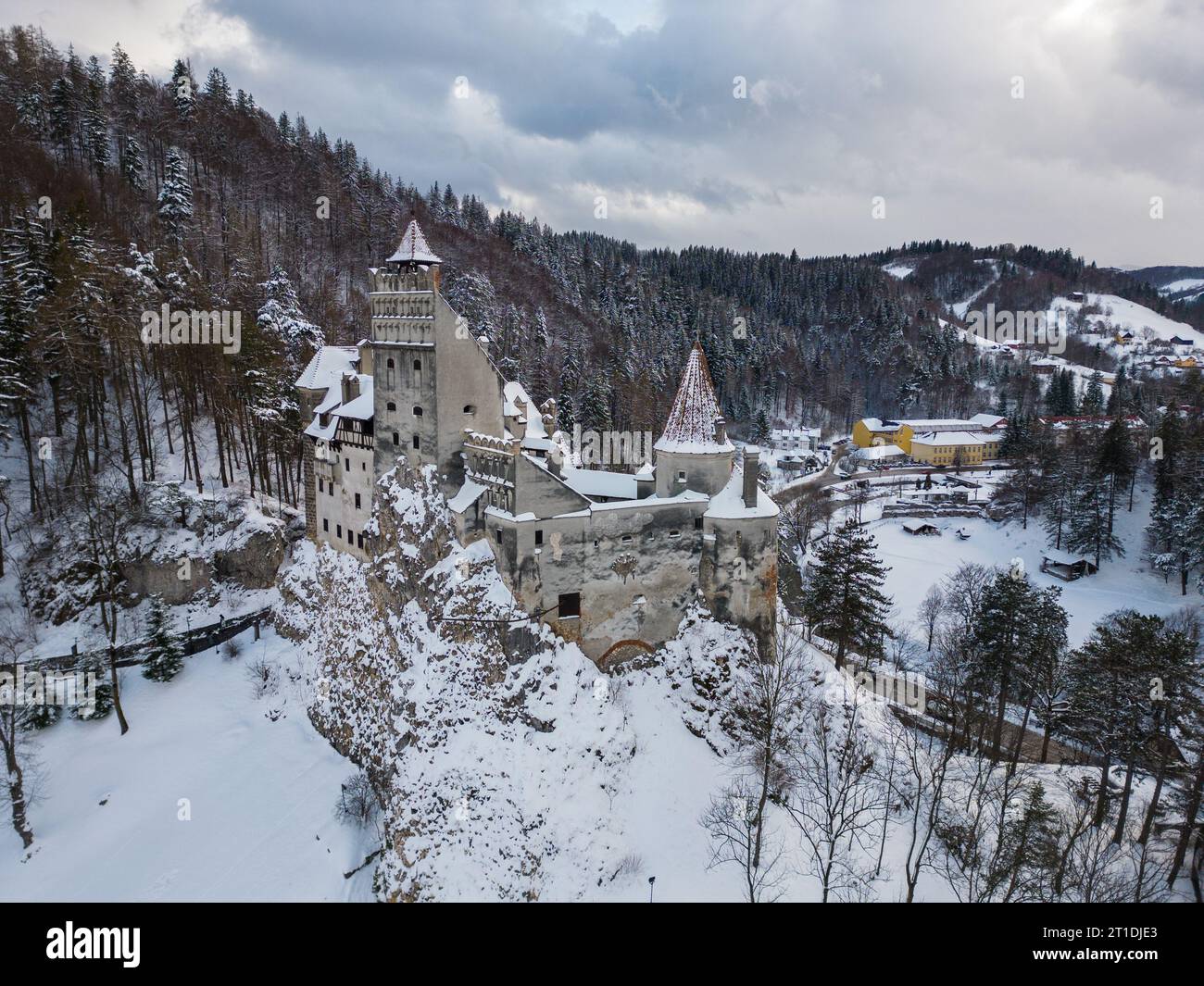 The snow covered medieval Castle of Bran, known for the castle of ...