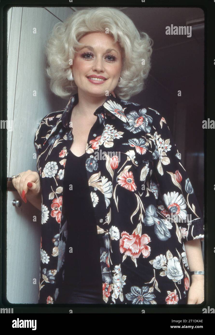 Dolly Parton in a floral print blouse on her tour bus during her ...