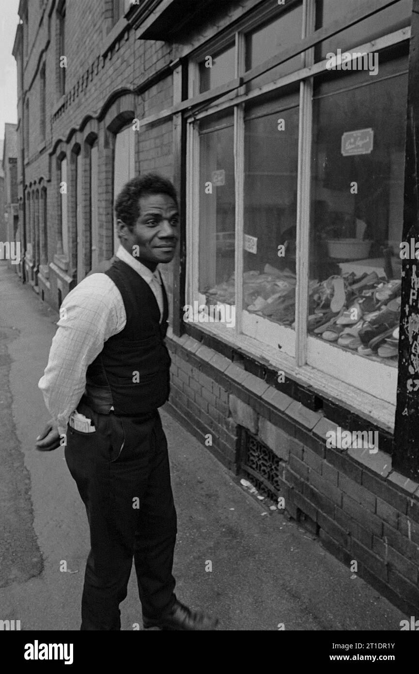 Black man outside a corner shop on Pym Street, Flewitt Street junction ...