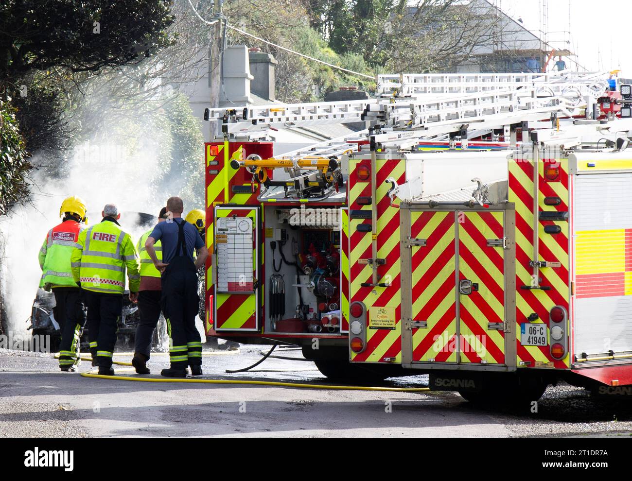 Fire Brigade Ireland putting out car fire Stock Photo - Alamy
