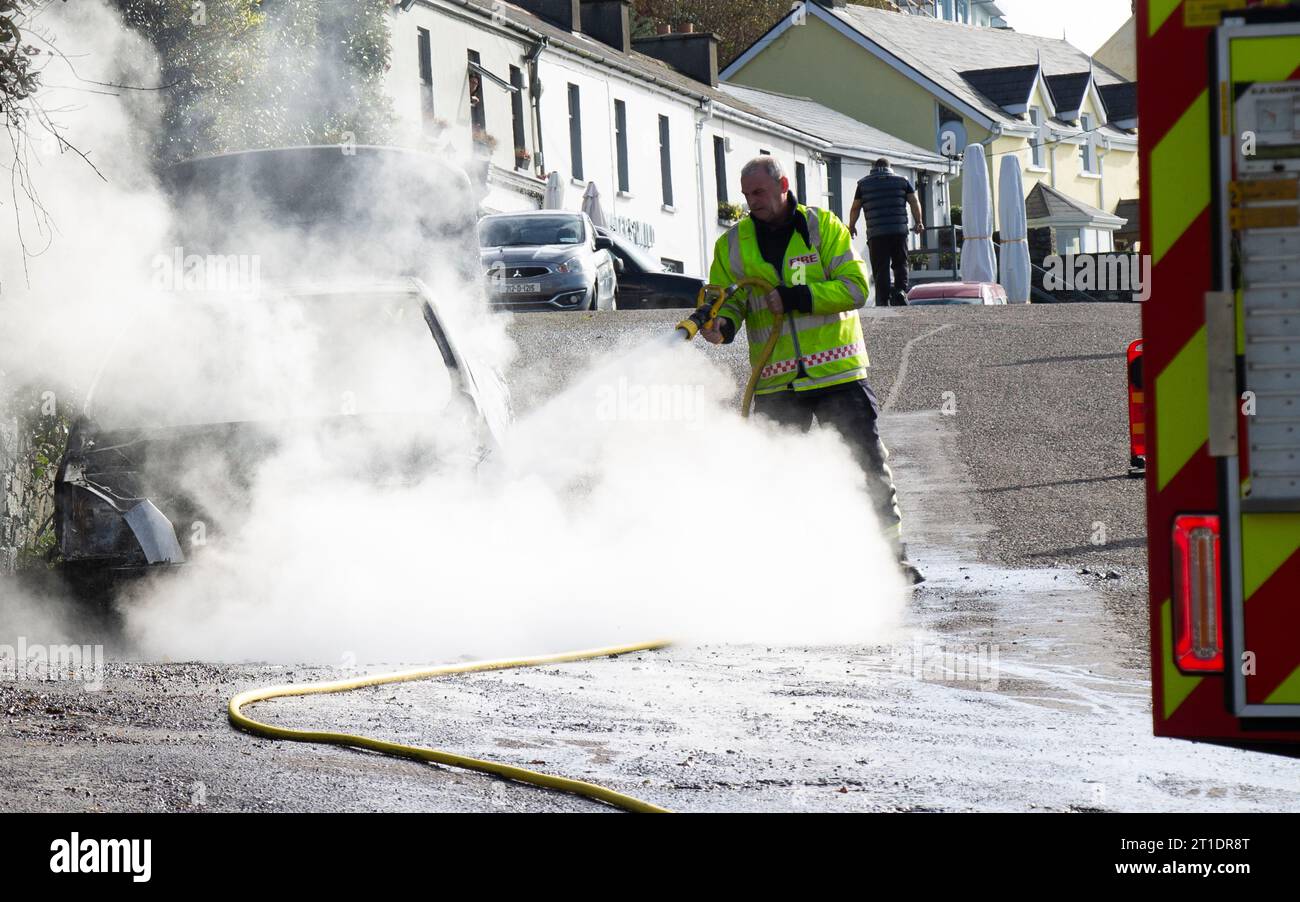 Fire Brigade Ireland putting out car fire Stock Photo - Alamy