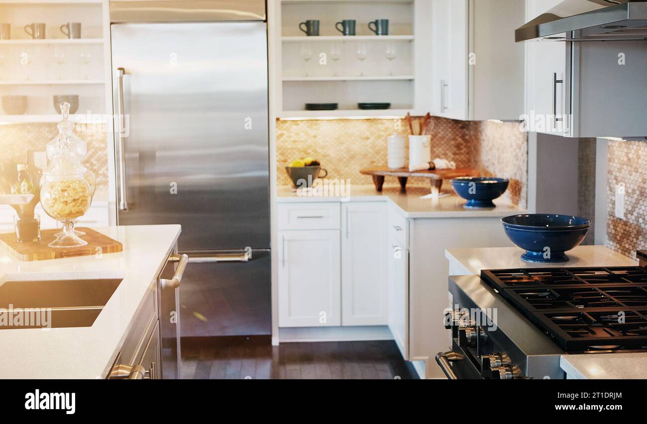 Home, kitchen and cupboard in modern design, bright and decor in lens ...