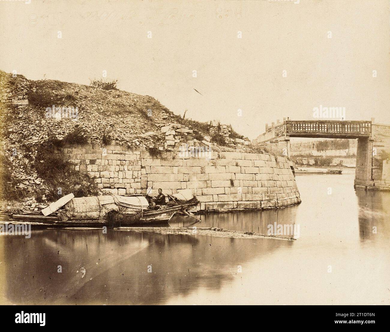 Walled River with Bridge and Houseboats, 1860 Stock Photo - Alamy