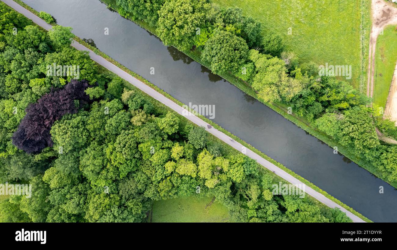 An exquisite top-down aerial view of a serene river or canal winding ...