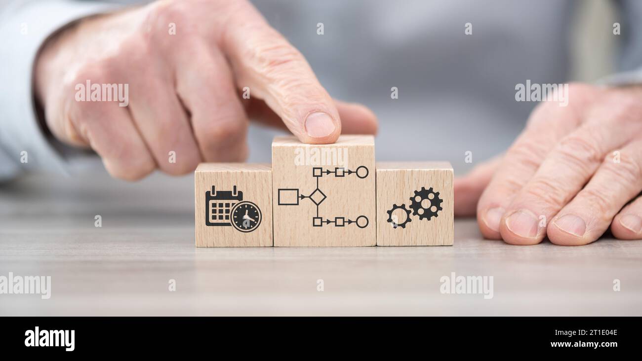 Wooden blocks with symbol of workflow concept Stock Photo - Alamy
