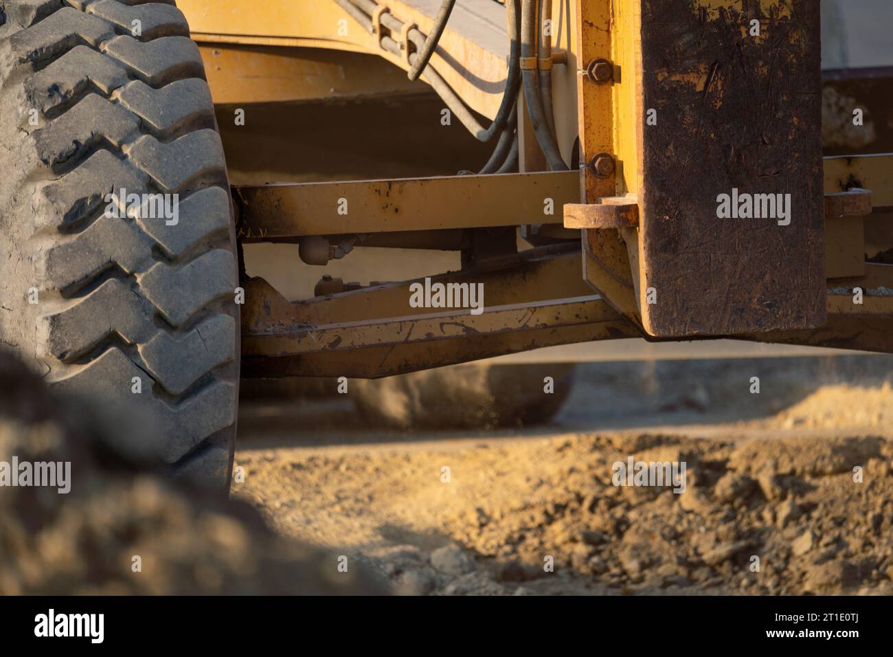 Road grader working at construction site for maintenance and ...