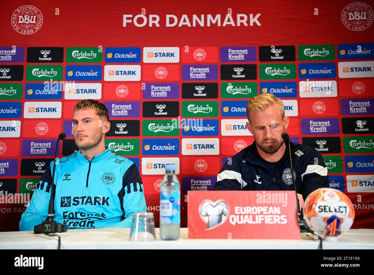 Denmarks players Jonas Wind (L) and Kasper Schmeichel attends a press ...
