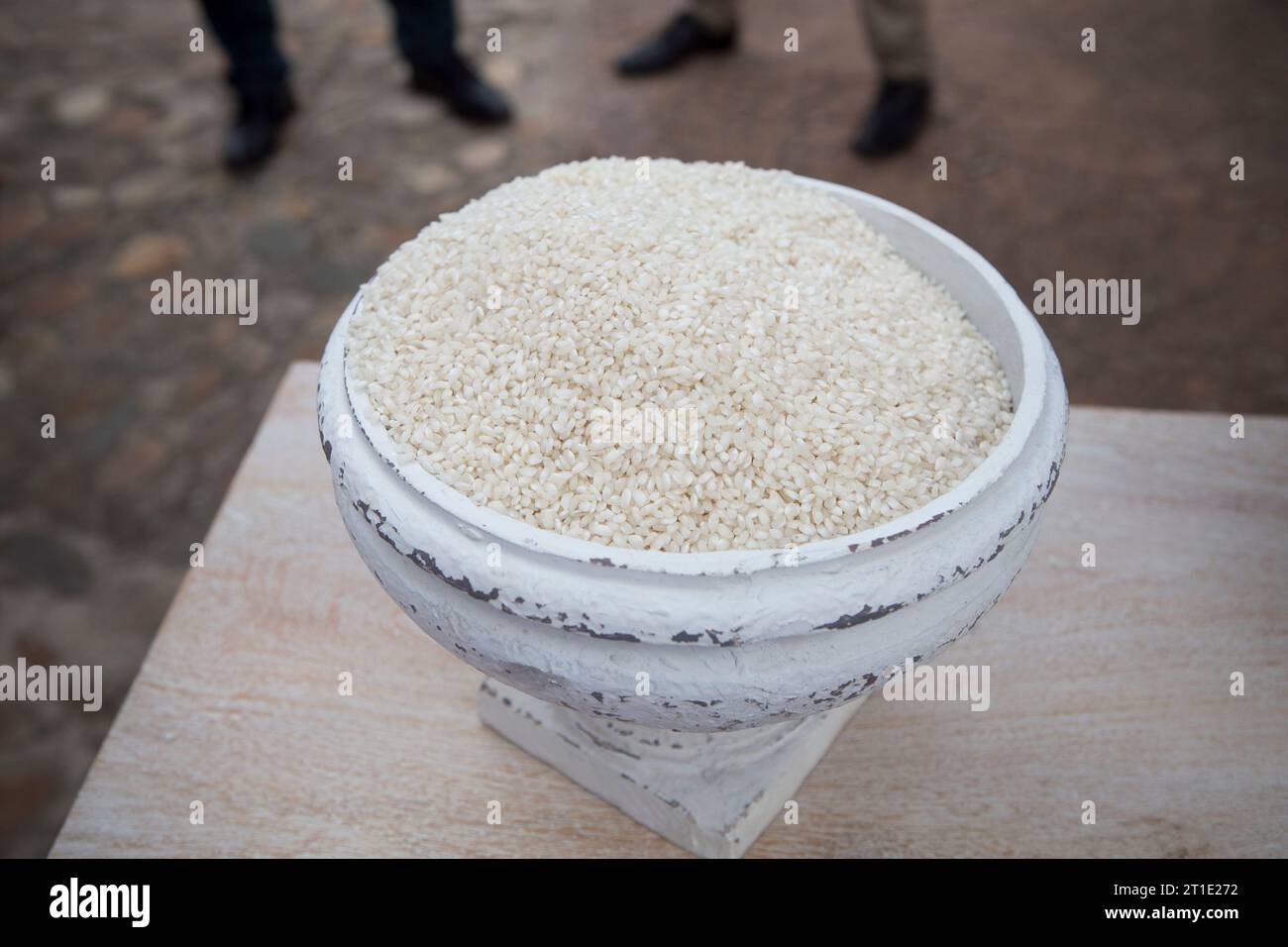 Greek vase with rice for wedding. Guest legs as background Stock Photo ...