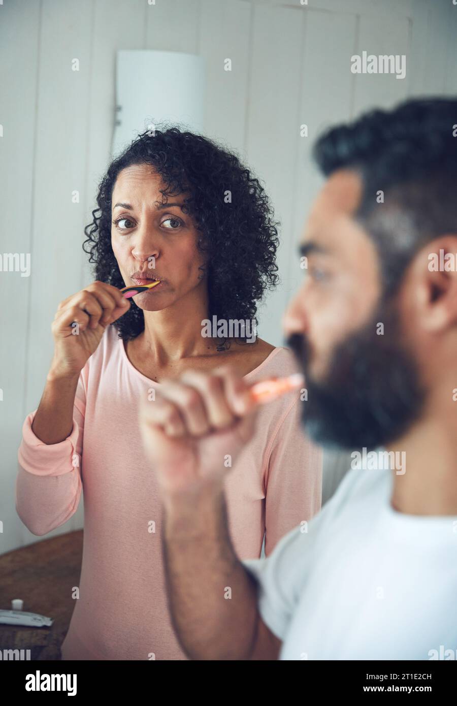 Couple, brushing teeth and bathroom in morning, dental wellness and ...