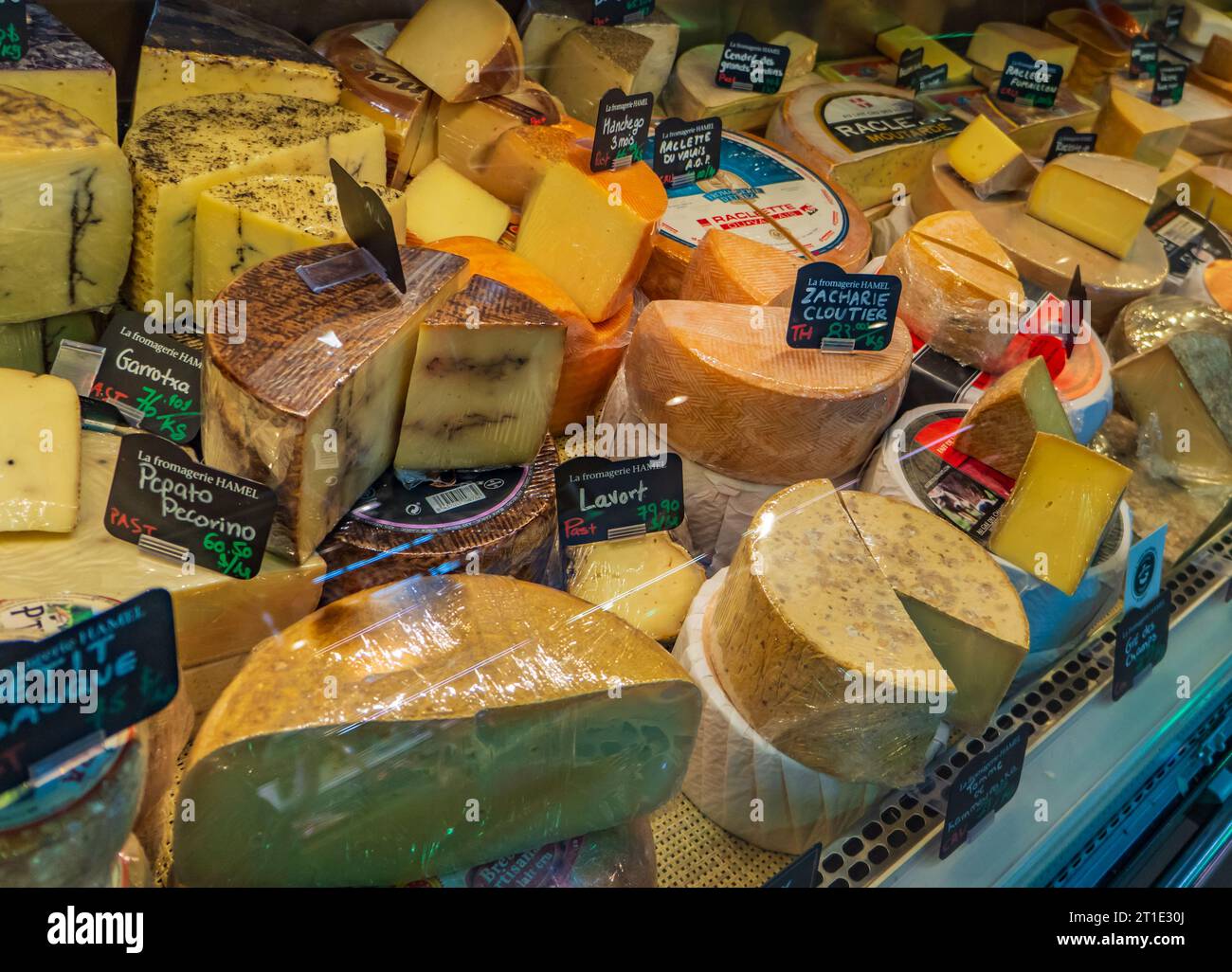 cheese counter with many varieties of cheese at Atwater market in ...