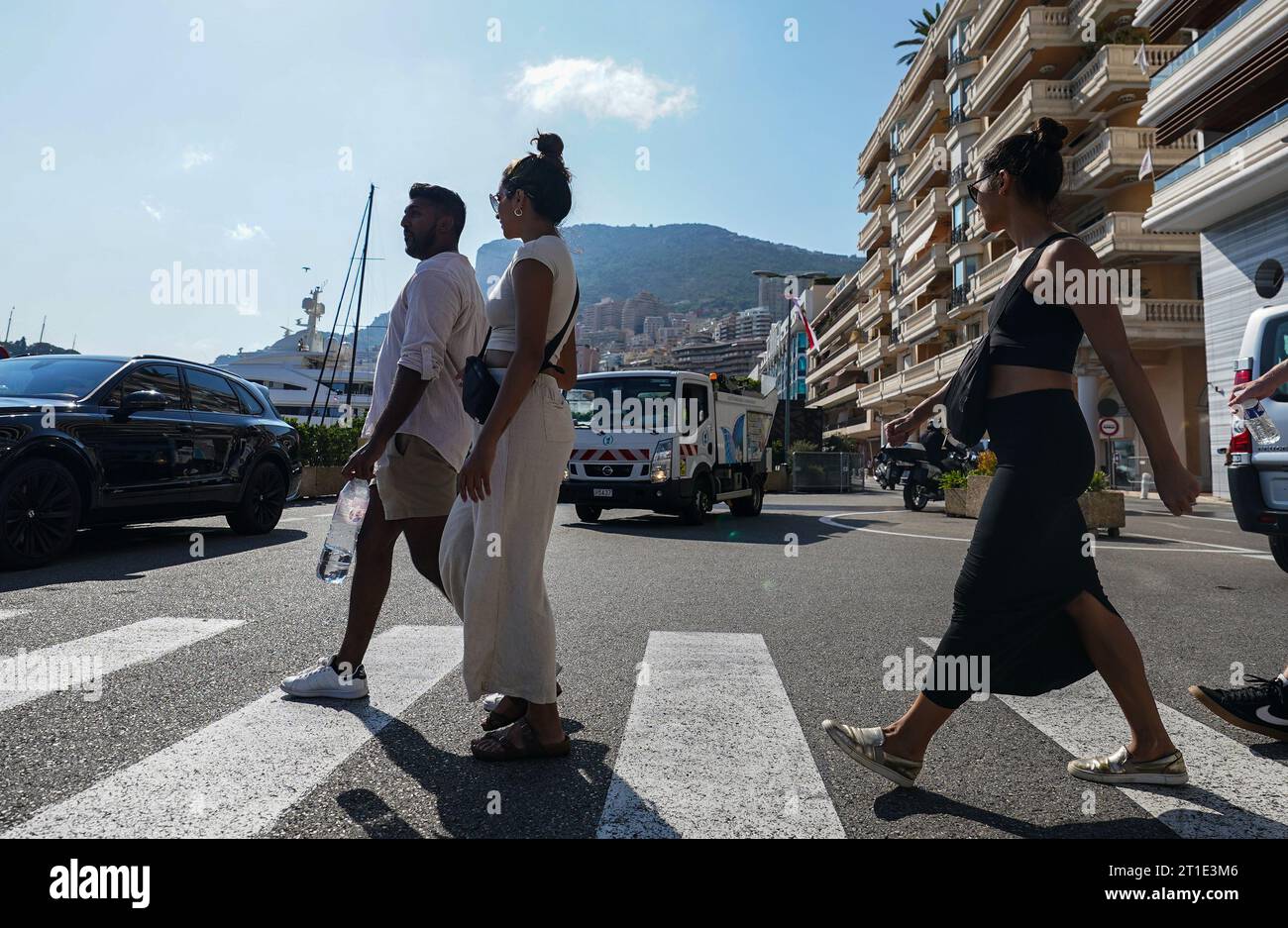 Pedestrians walk through the Nouvelle Chicane on the Monaco Grand Prix ...