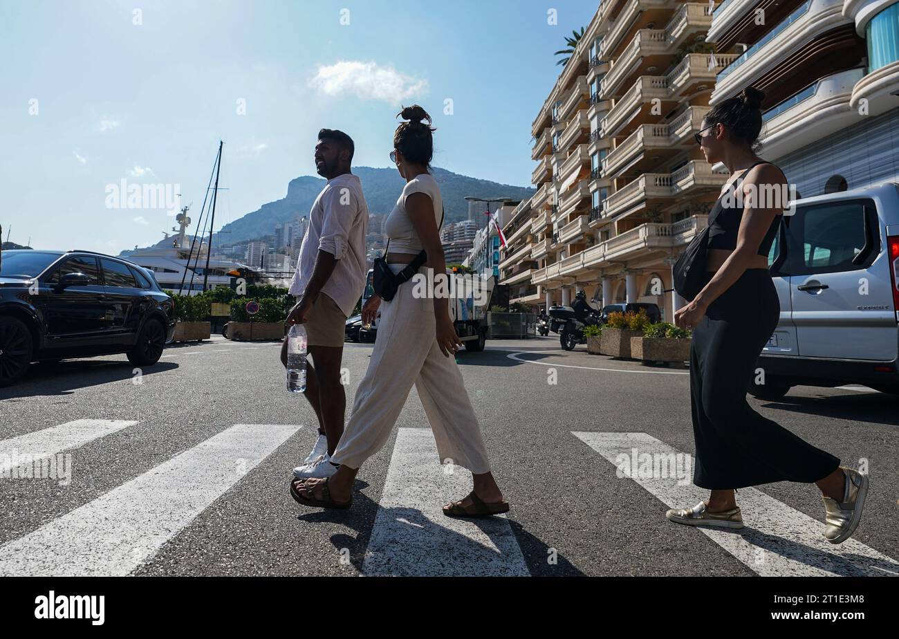 Pedestrians walk through the Nouvelle Chicane on the Monaco Grand Prix ...