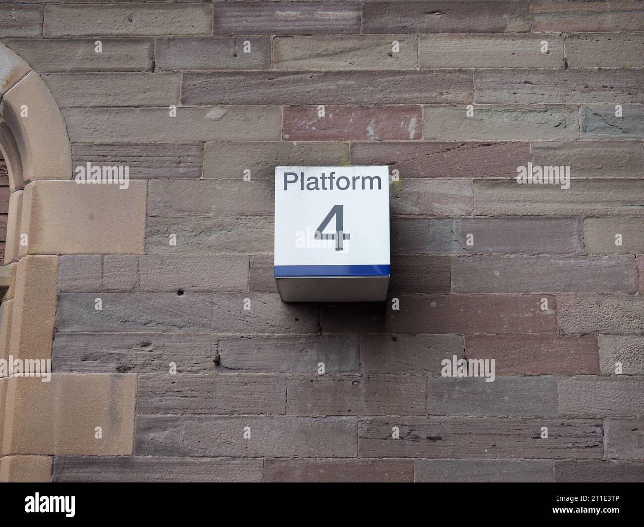platform 4 sign on railway station wall Stock Photo - Alamy