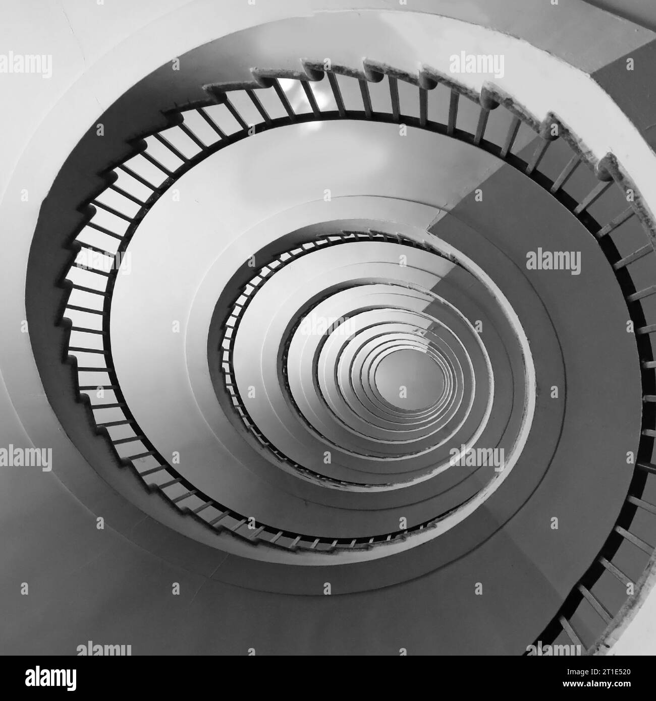Spiral staircase seen in perspective with the steps going towards ...