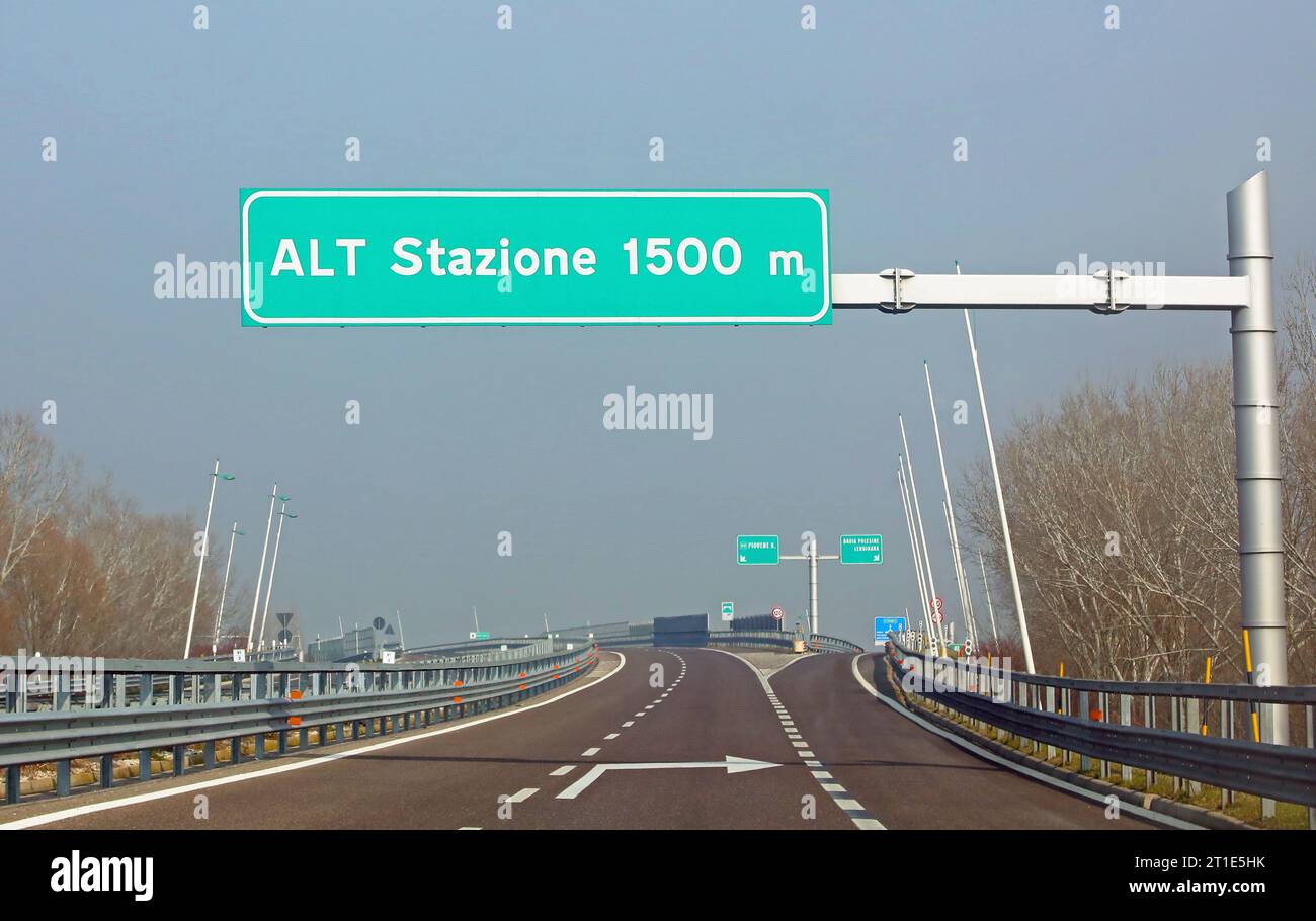 road sign in the middle of the motorway which means stop station at ...