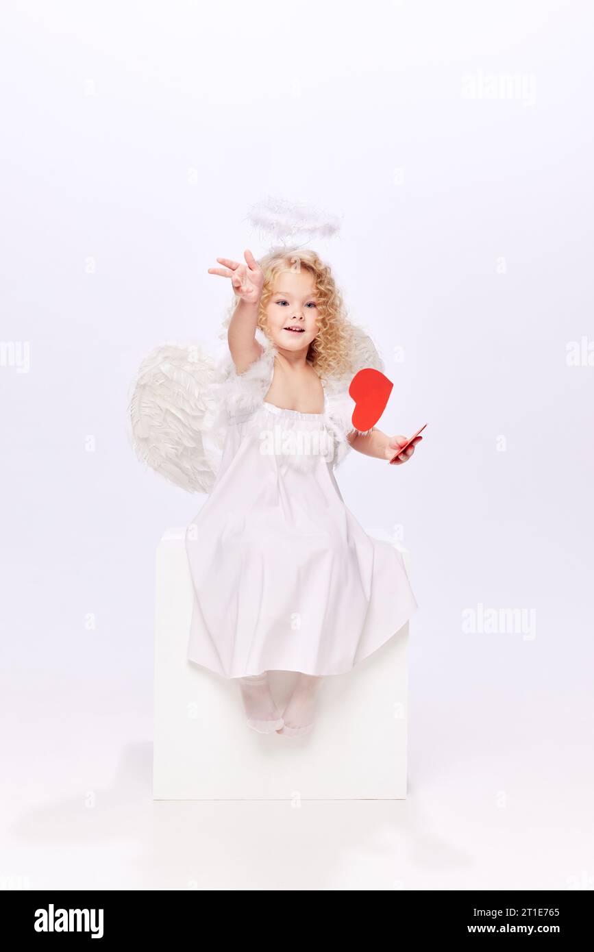 Happy Valentine's Day. Little baby cupid, beautiful girl in white dress ...