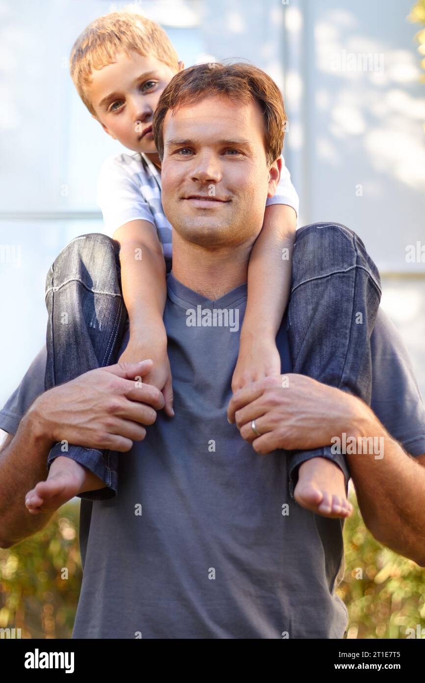 Piggy back, portrait and dad with son in backyard, cute bonding ...