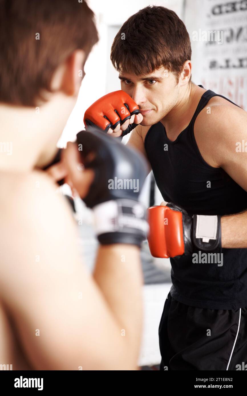 Man, fighting and boxing in martial arts training with sparring partner ...