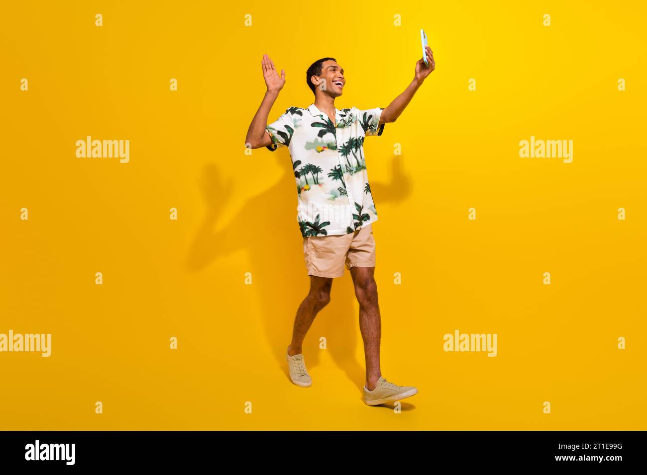 Full size photo of handsome young guy take selfie walking wave hand ...