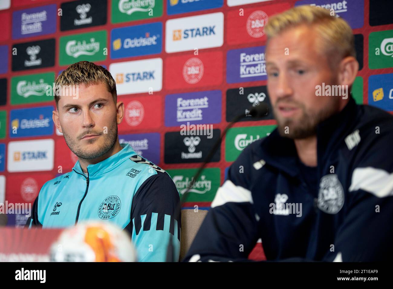 Denmarks players Jonas Wind (L) and Kasper Schmeichel attends a press ...