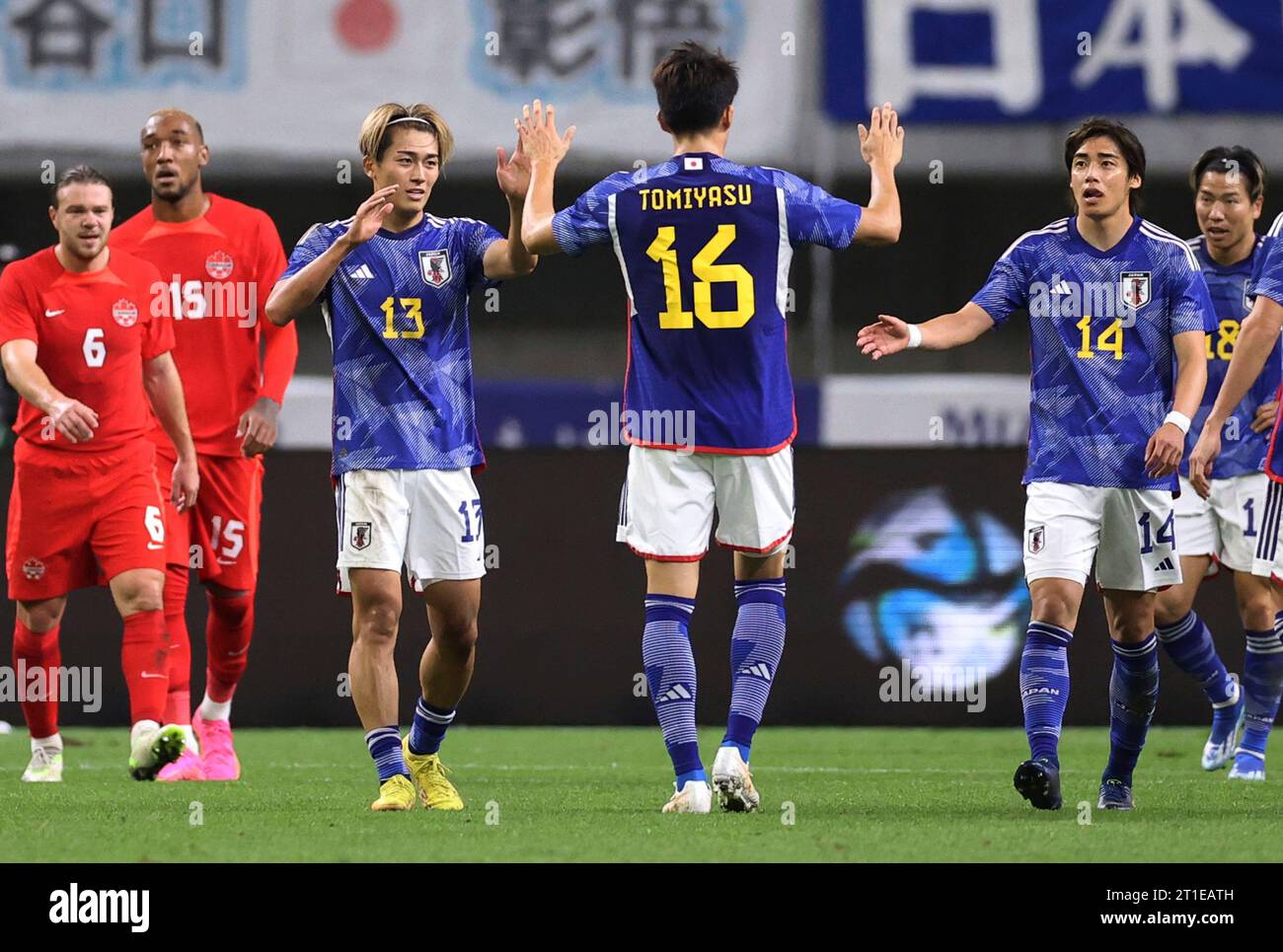 Keito Nakamura of Japan (13) celebrates aftre scoring in the first half ...