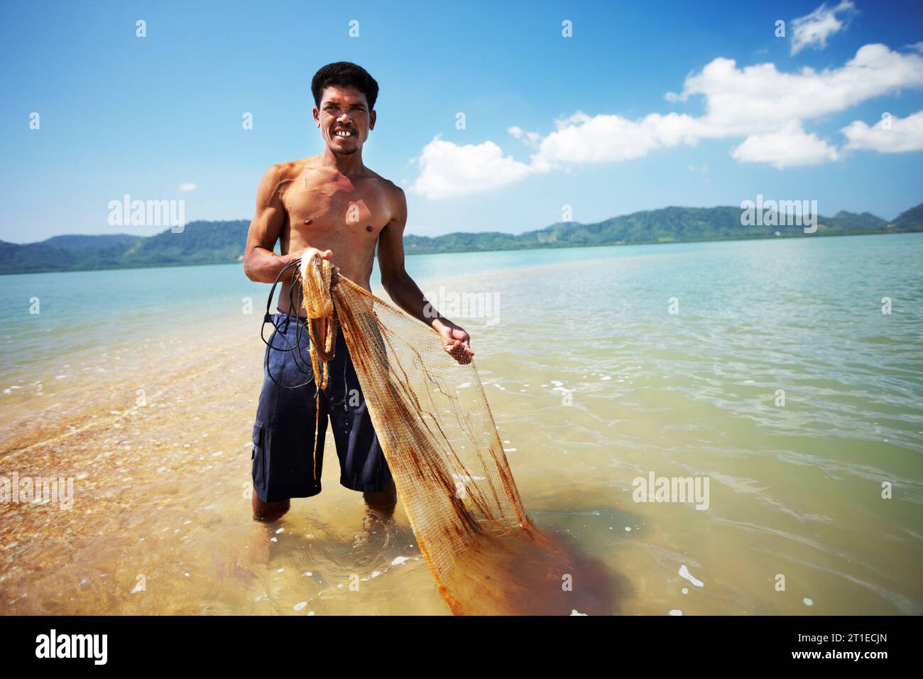 Fisherman, ocean and man with net working, nature and labor with ...