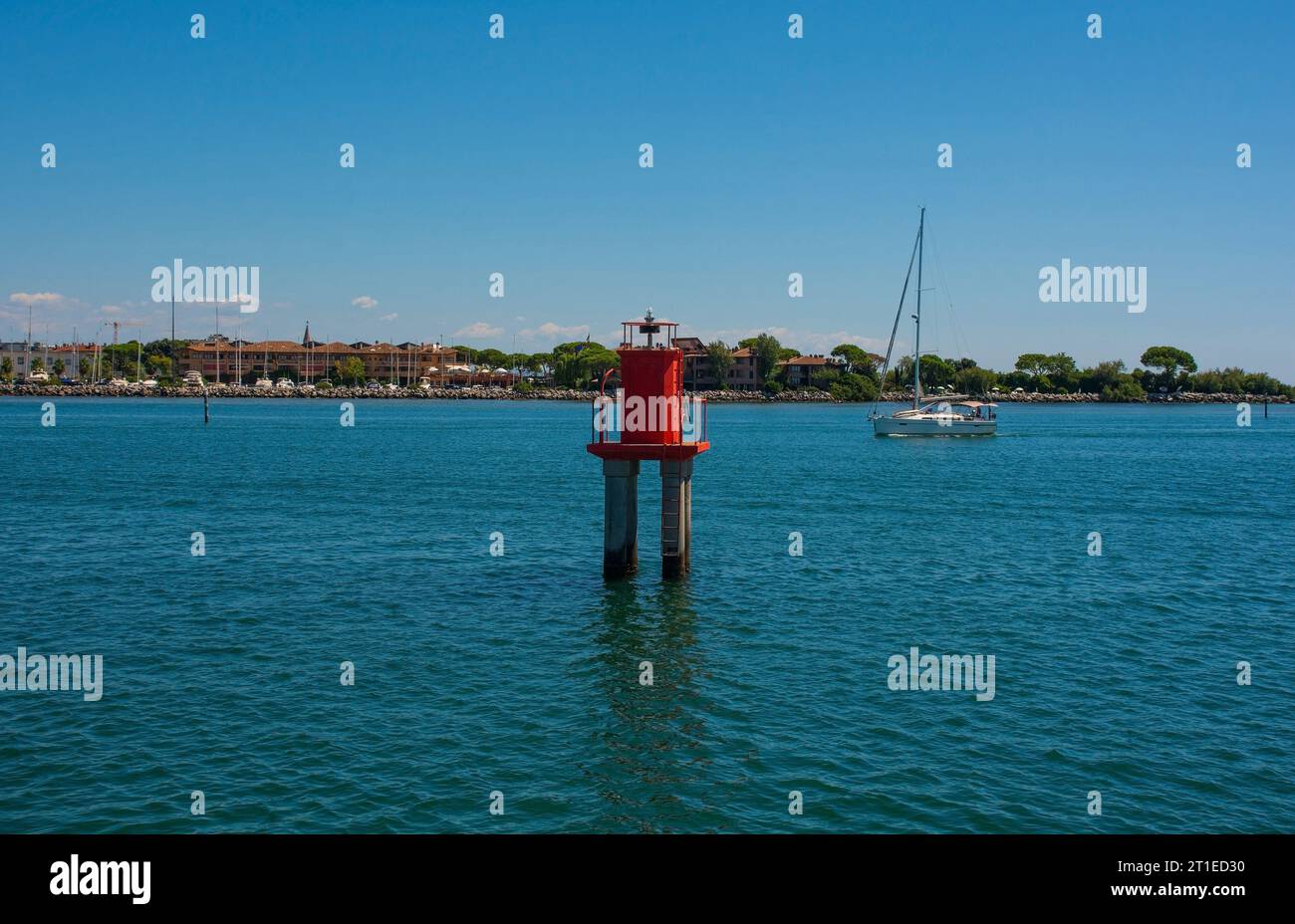 A lighthouse at Grado in the shallow waters of the Marano and Grado ...