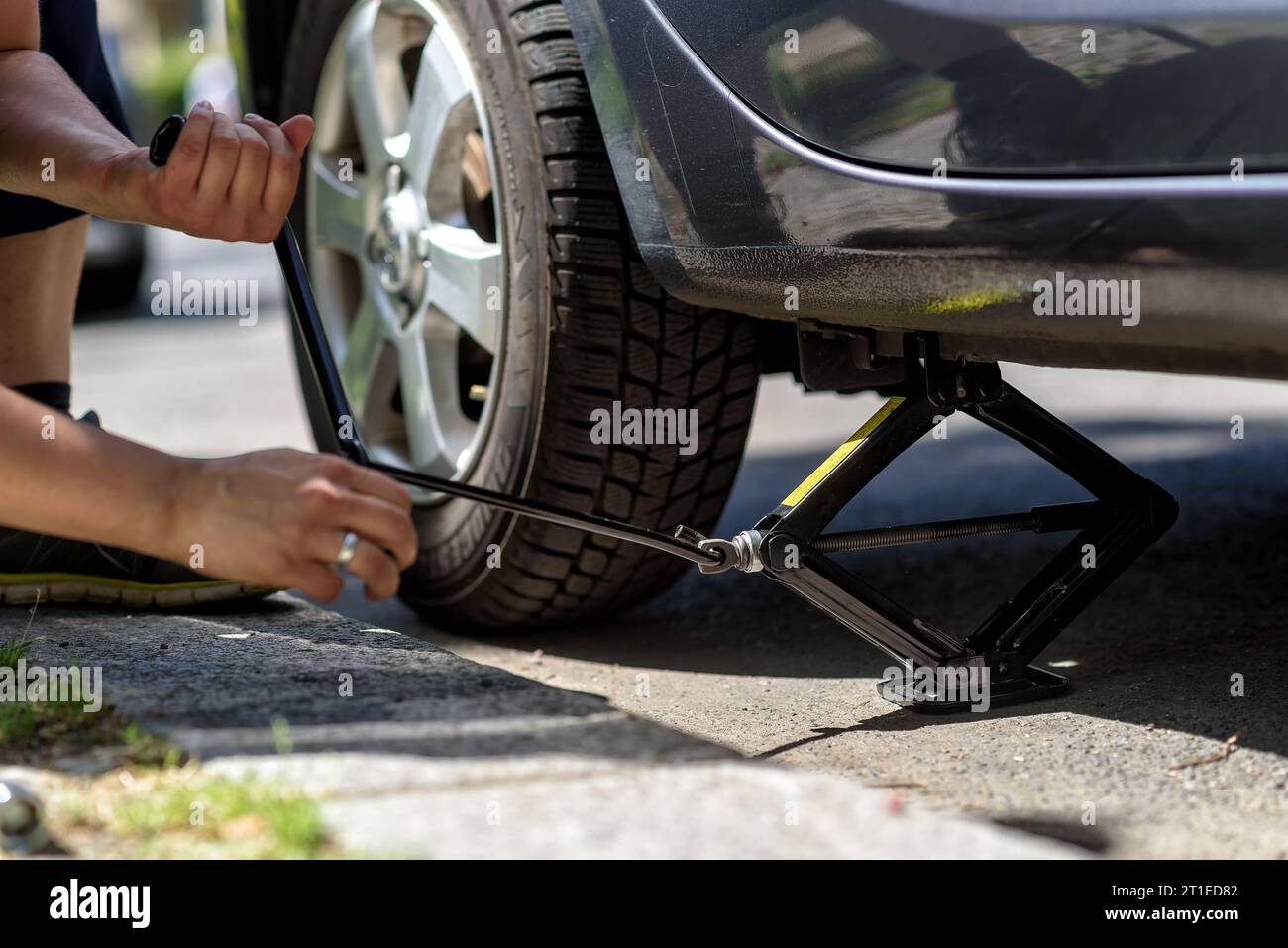 changing the tires of a car from winter tires to summer tires in spring ...