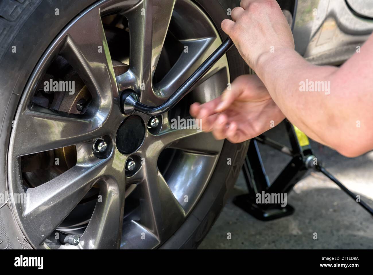 changing the tires of a car from winter tires to summer tires in spring ...