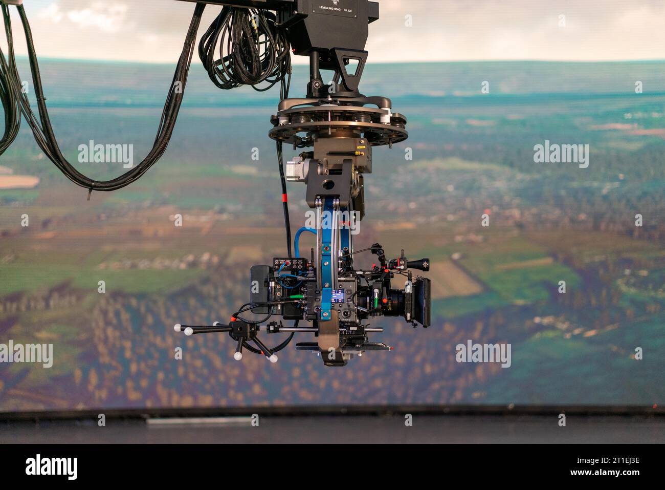 A sony Venice camera attached to a large gib in front of a virtual ...