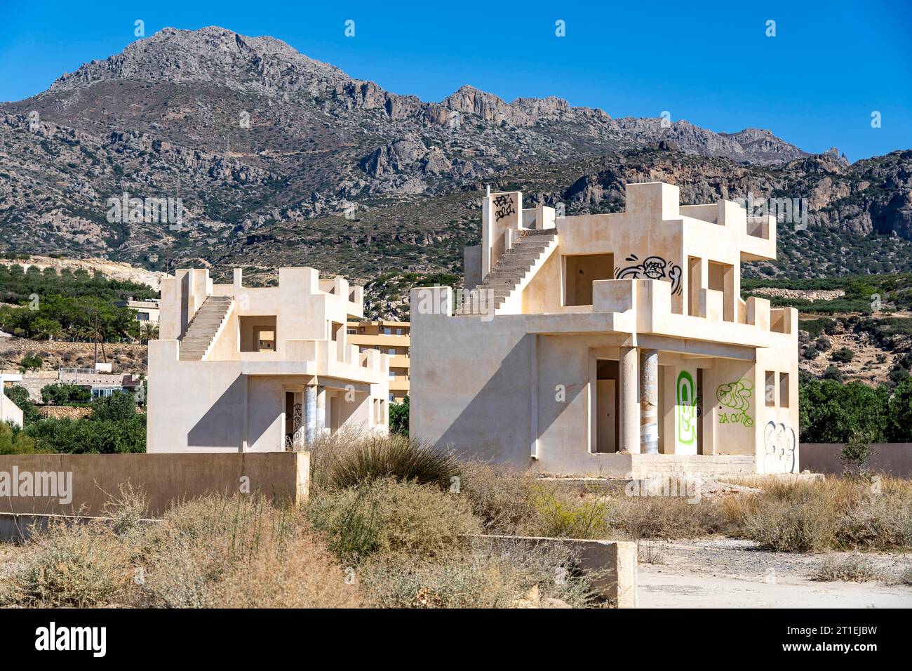 Ruined buildings, houses that were started but not continued, bay at ...