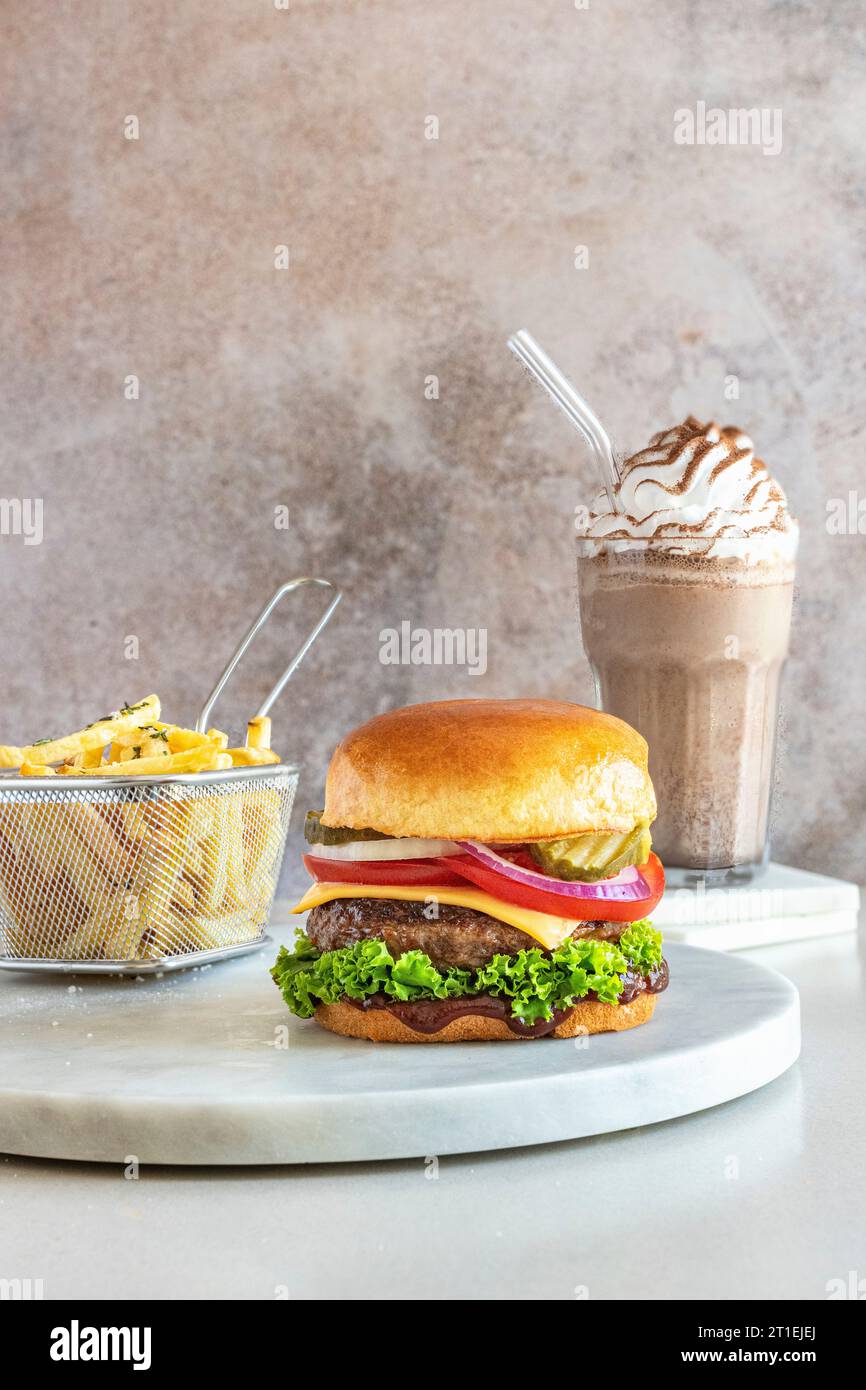 Beef burger with fries and milkshake i Stock Photo - Alamy