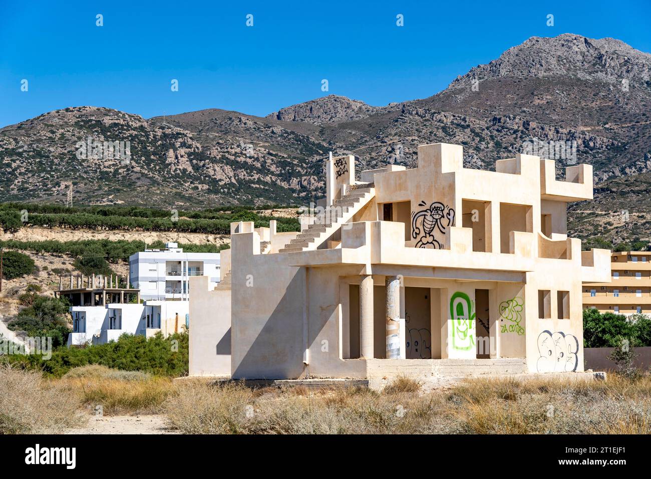 Ruined buildings, houses that were started but not continued, bay at ...