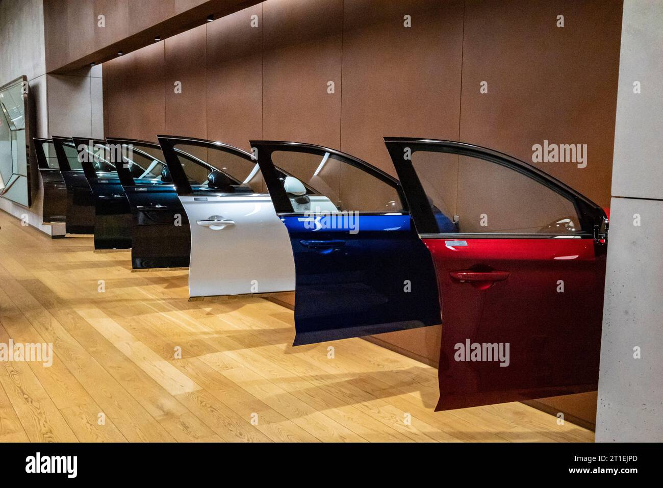 Different colors option of car doors on display at the car dealership ...