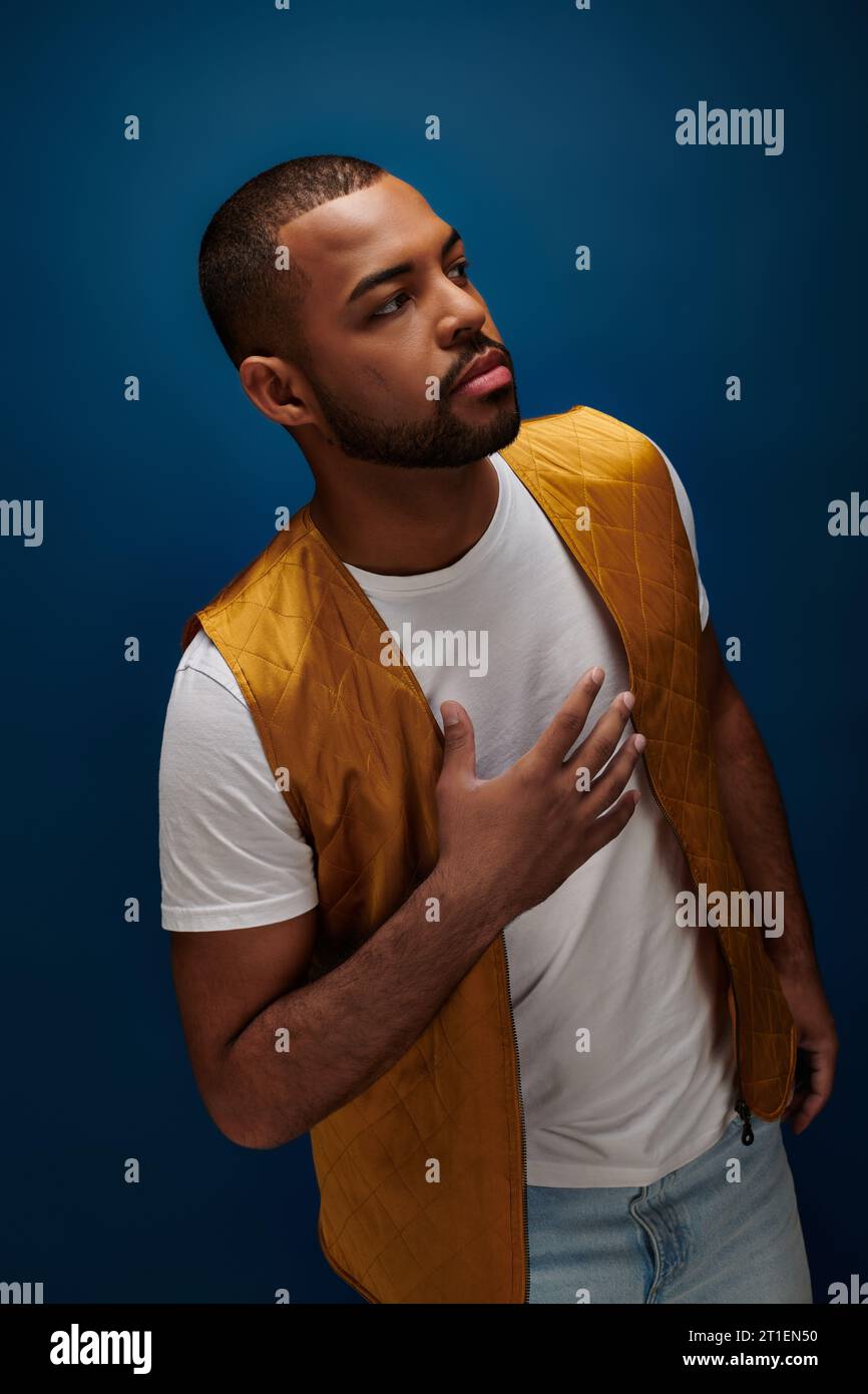 handsome african american man with beard looking away with hand on his ...