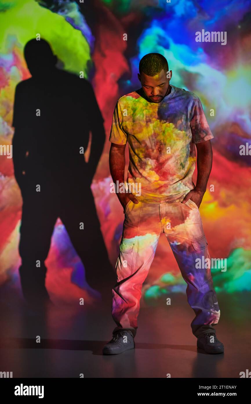 handsome african american man standing looking down in digital ...