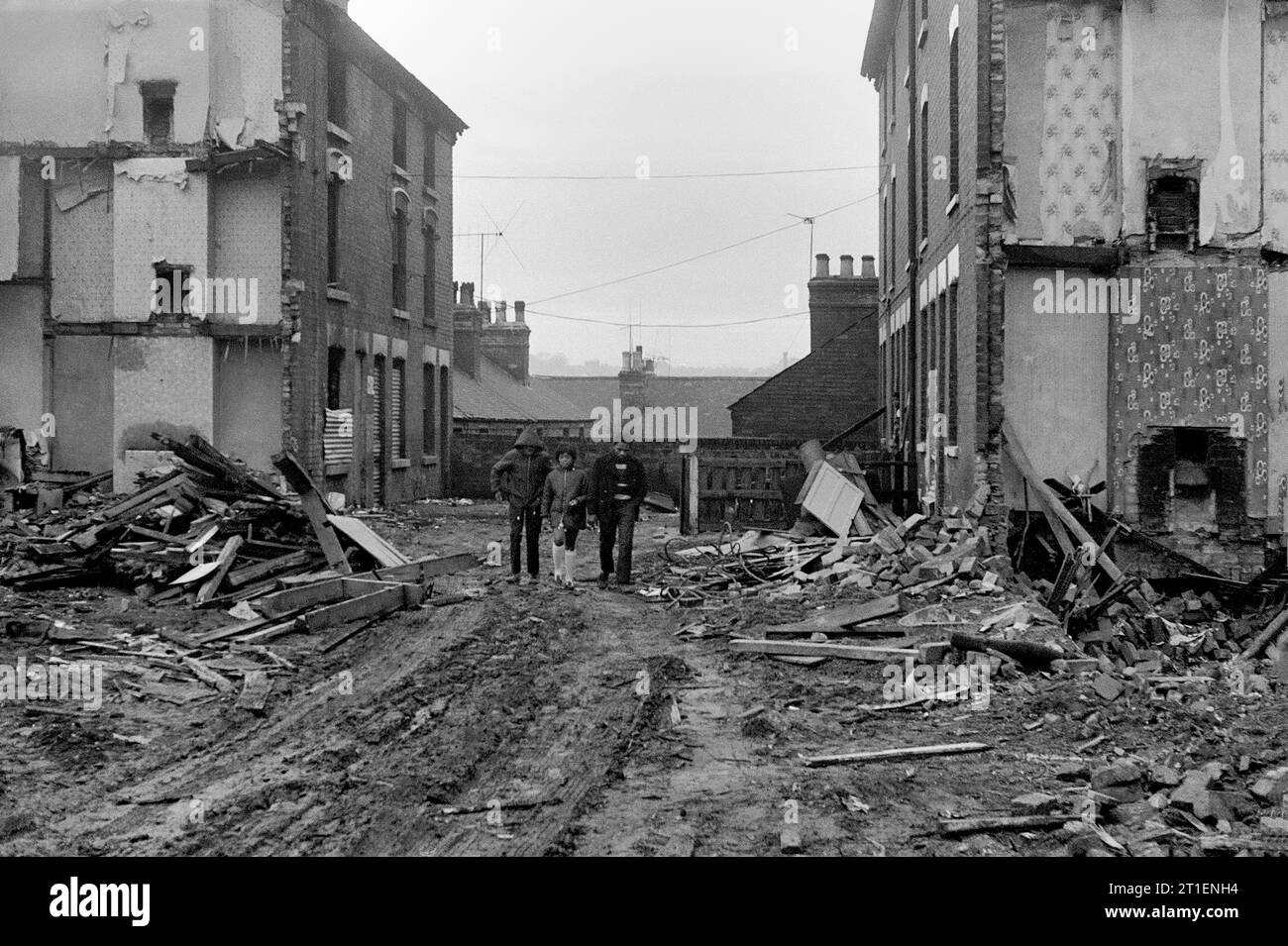 Family walking in the rubble of demolished Victorian terraced houses 's ...